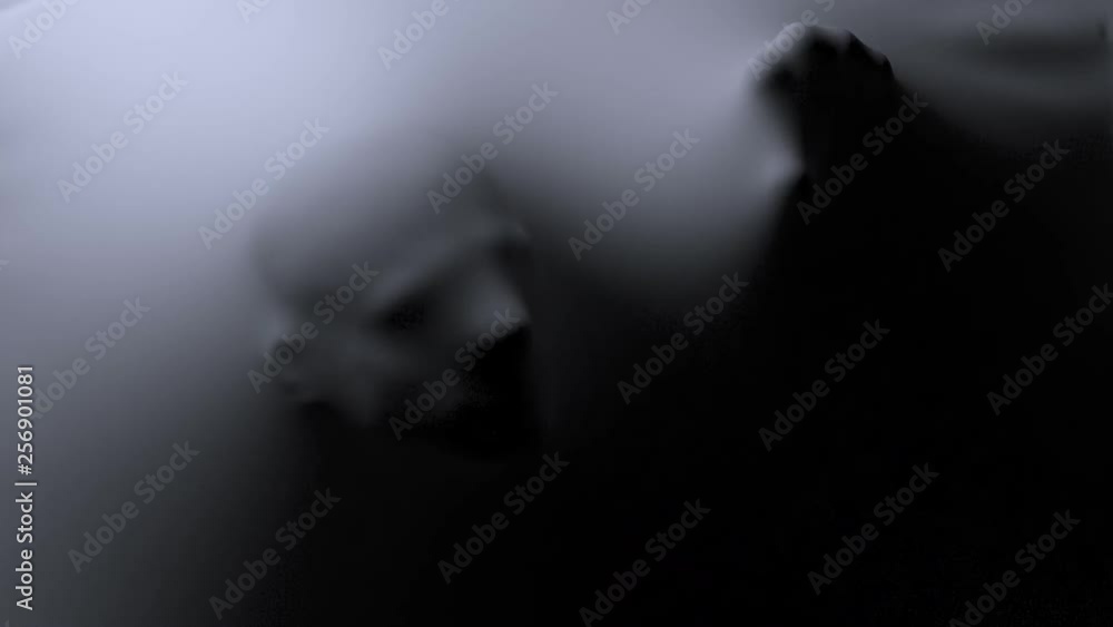 Creepy clip of an animated head and hand/arm pushing through a cloth ...