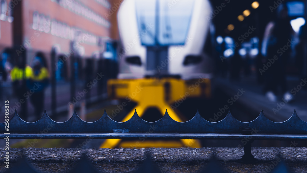 Steel sharp teeth close up and train on platform backdrop at ...