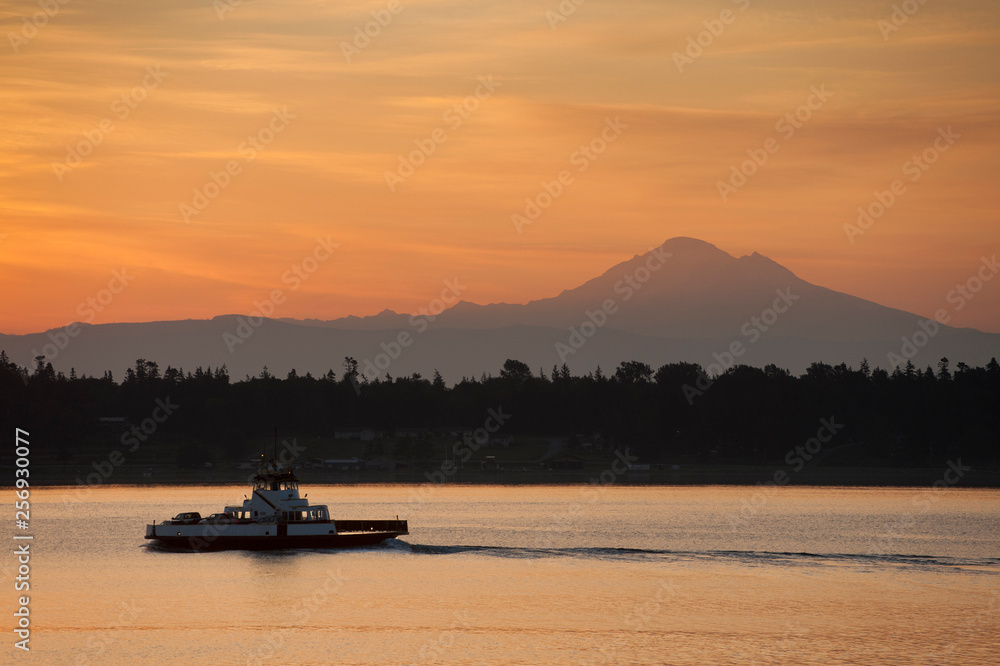 Ferry Boat With Mt. Baker in the Background. A small ferry boat from ...