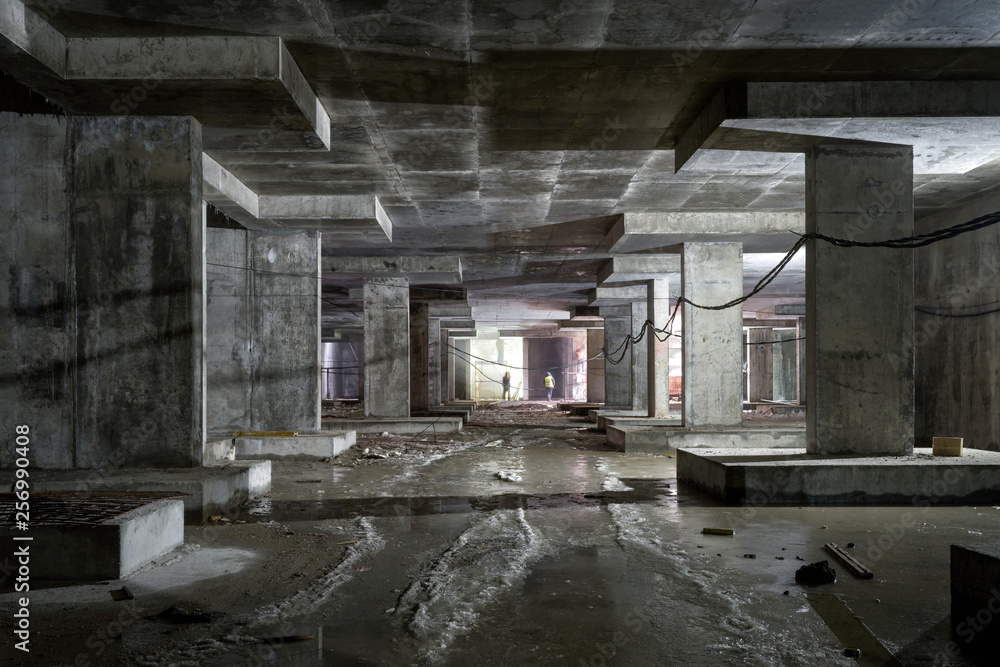 Concrete construction of underground level of building. Panorama inside ...