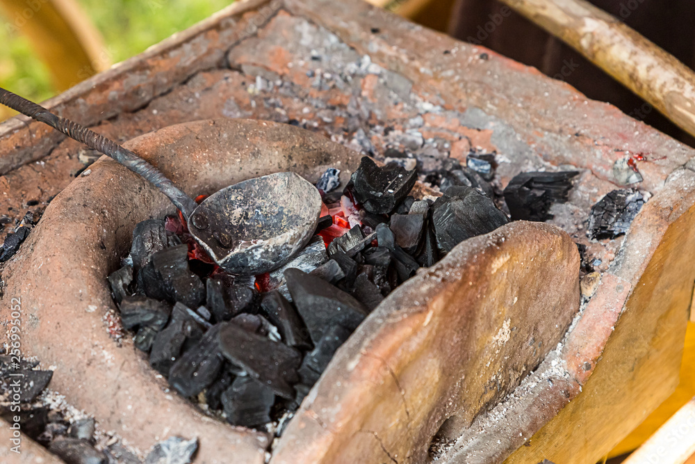 horn blacksmith coal with smoldering fire spoon ladle smelting metal ...