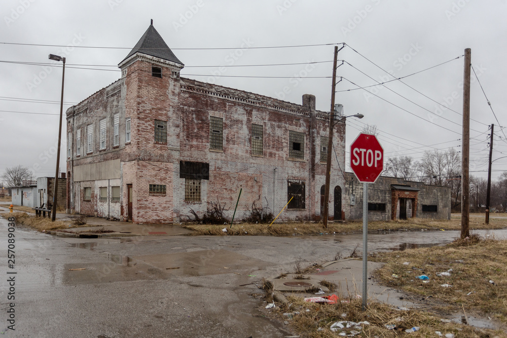 Stopped at a vintage brick apartment building left abandoned in a ...