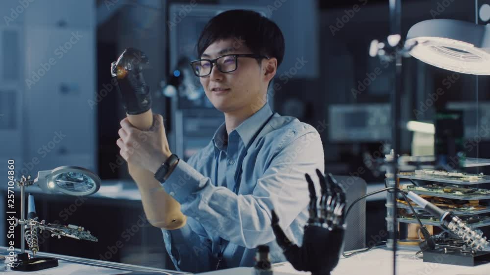 Futuristic Prosthetic Robot Arm Being Tested by a Professional Japanese ...