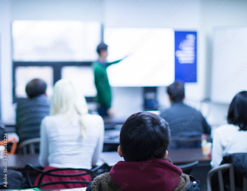 Audience in the Lecture Hall. Teacher Giving a Lecture in Classroom ...