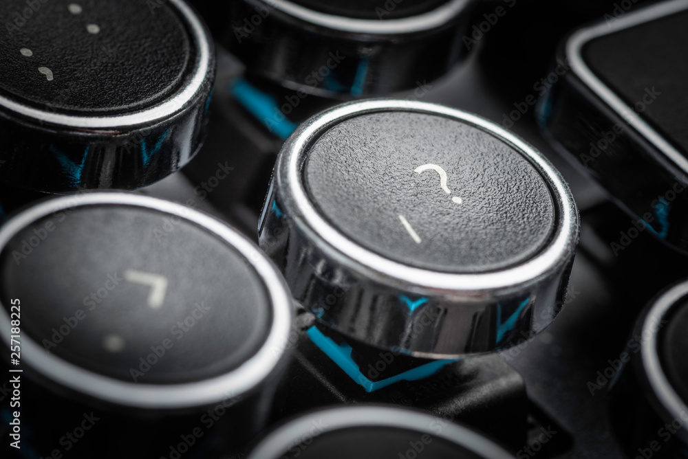 An extreme close-up or macro shot of a round slash and question mark ...