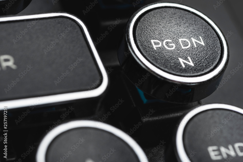 An extreme close-up or macro shot of a round PG DN key on a vintage ...