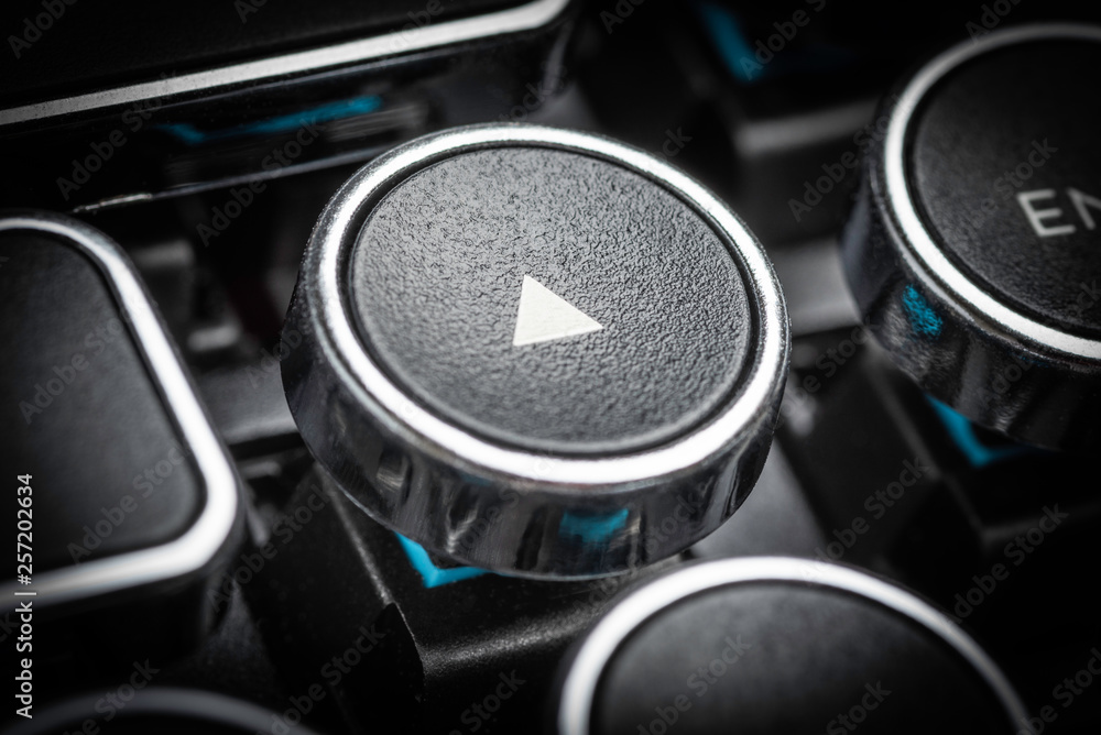 An extreme close-up or macro shot of a round directional arrow key on a ...
