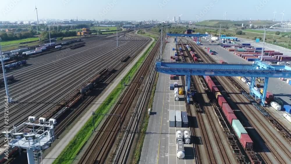 Aerial Bird View Of Railroad Container Terminal With Train Loaded With Containers By Overhead