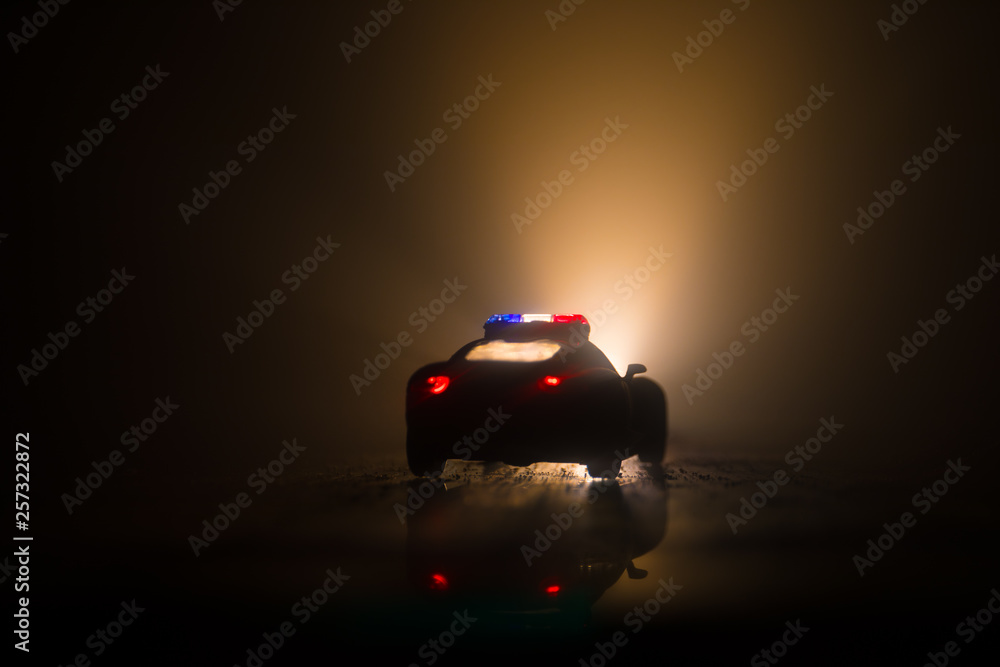 Police cars at night. Police car chasing a car at night with fog ...