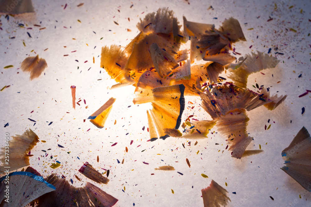 Chippings of color pencils of different colors, scattered over a piece ...