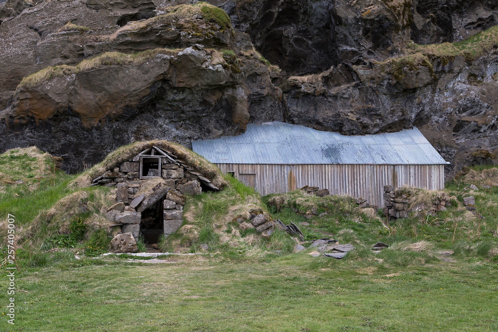 Icelandic turf roofed stone shed with wooden sheep shed built into the ...