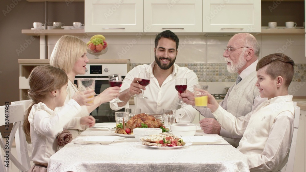 Family Sitting Around a Table, Eating, Communicating and Having Fun ...