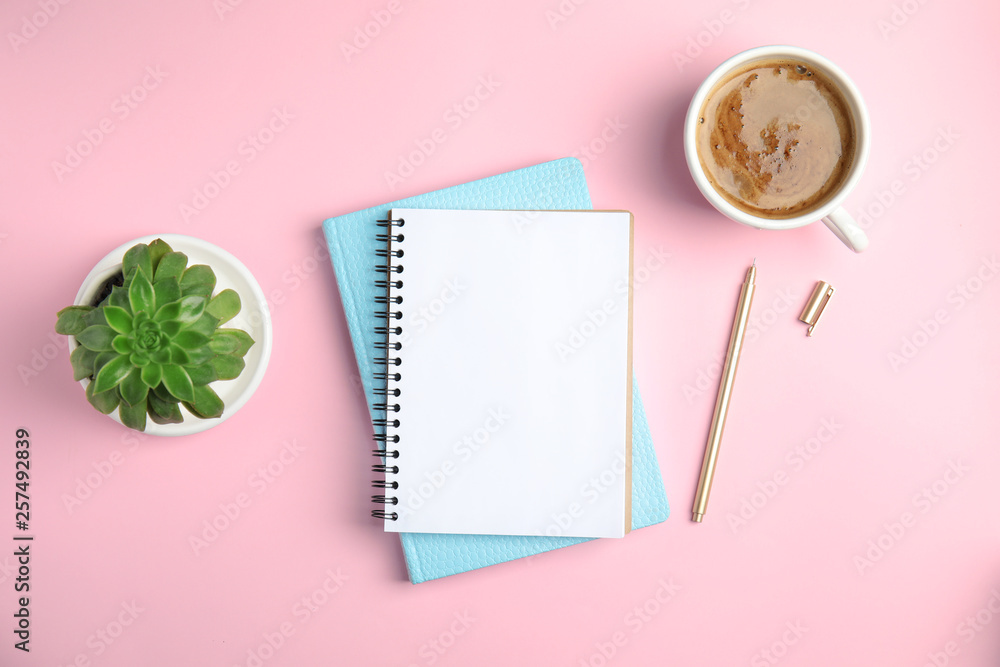 Flat lay composition with notebooks and coffee on color background ...