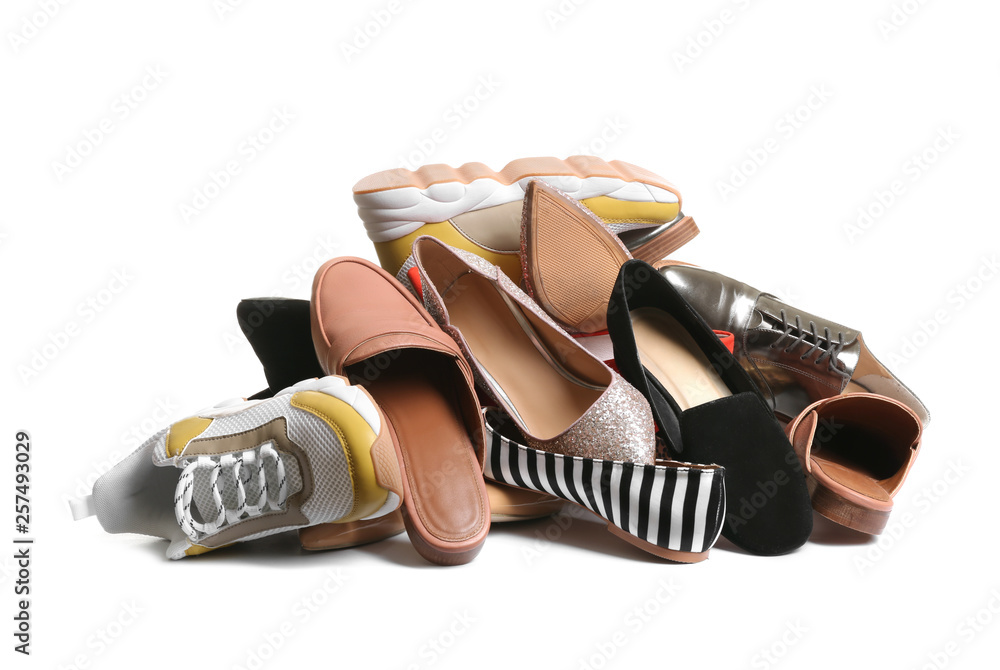 Pile of different shoes on white background Stock Photo | Adobe Stock
