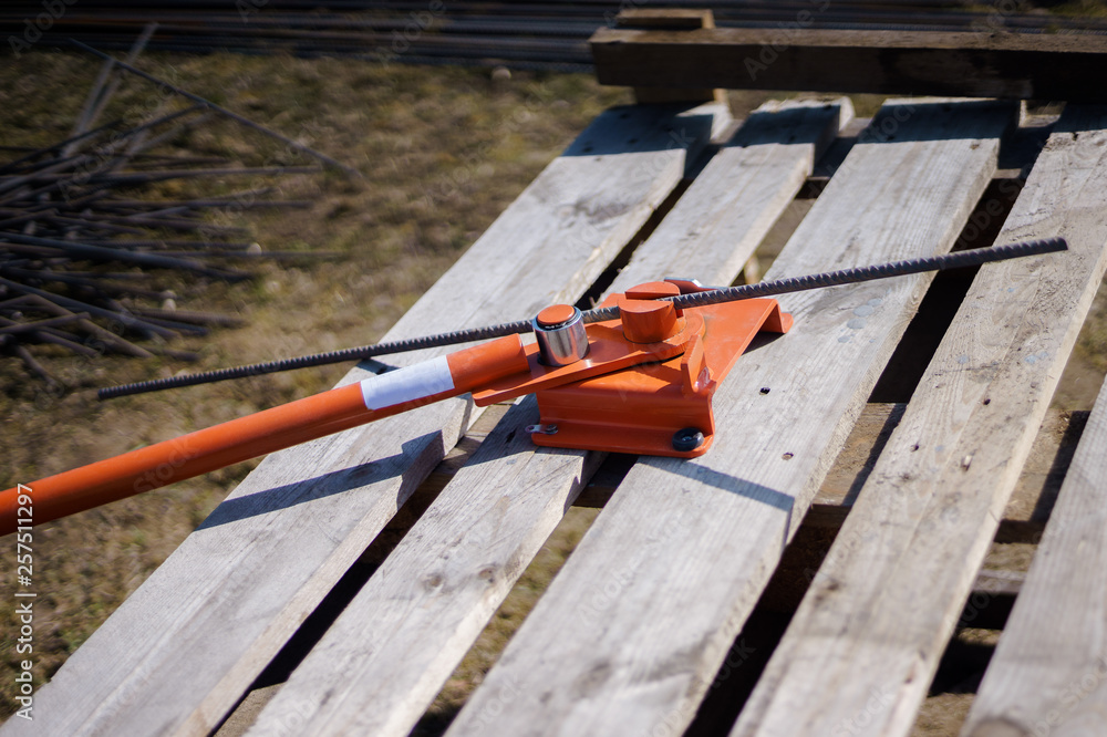 Bending rebar using a manual bending machine Stock Photo | Adobe Stock