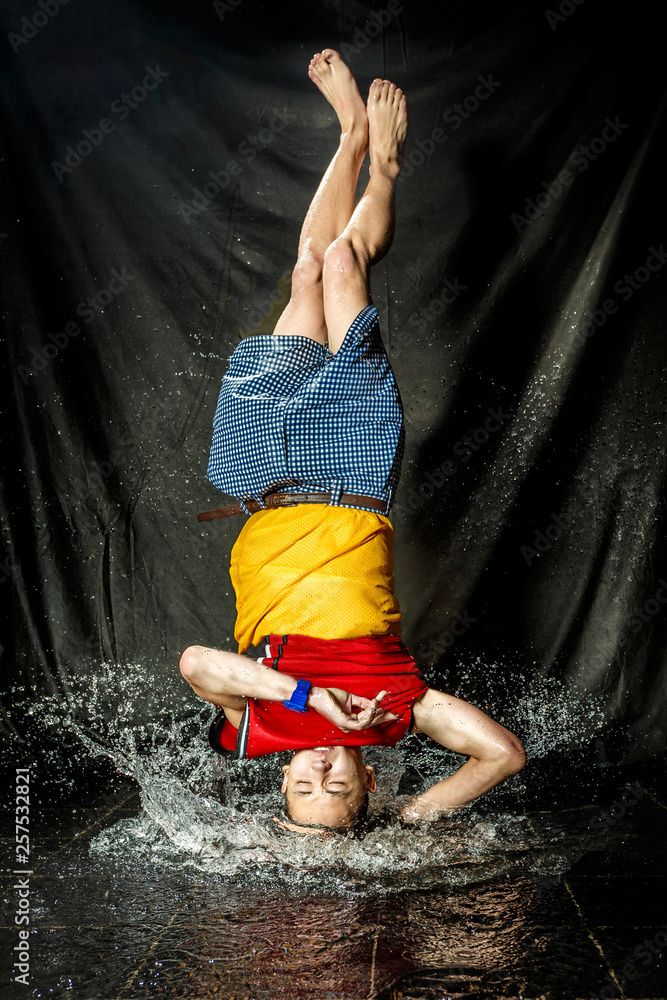 cool and happy korean young guy break dancer in style of bboying doing ...