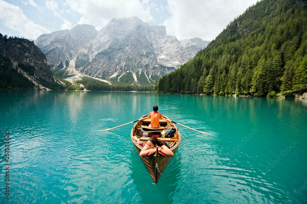 Couple in row boat on azure Lago di Braies, Italy Stock Photo | Adobe Stock