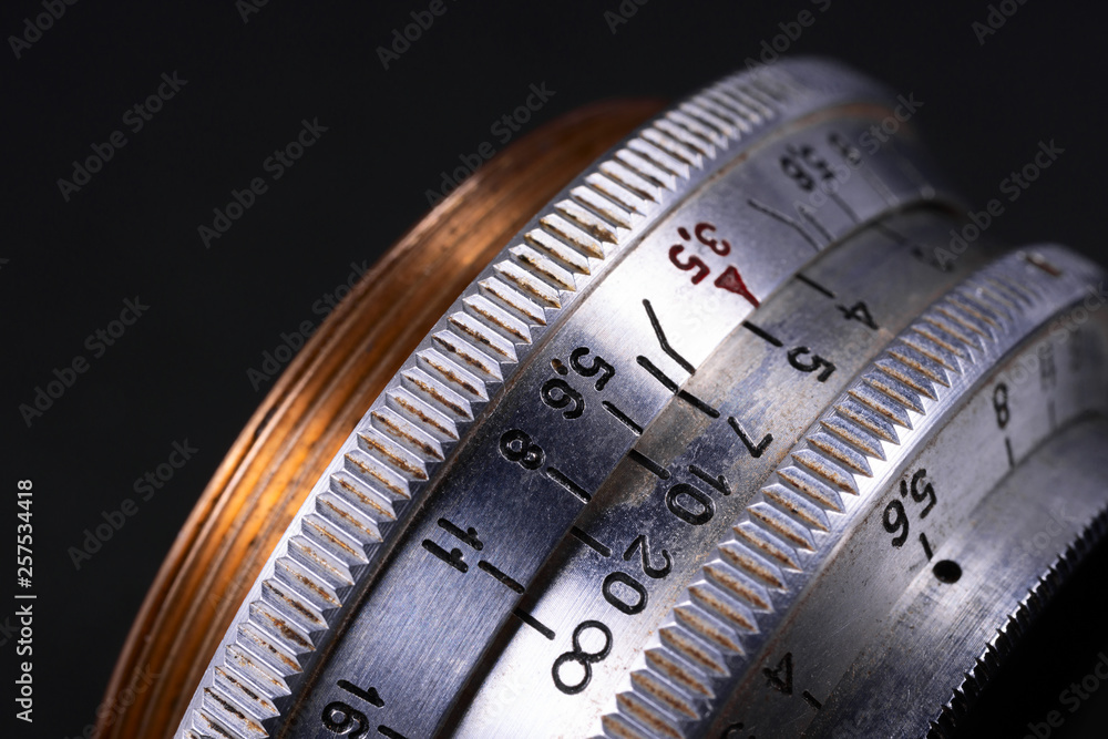 Old vintage lens scales symbols closeup view. Photo with blurred gray ...