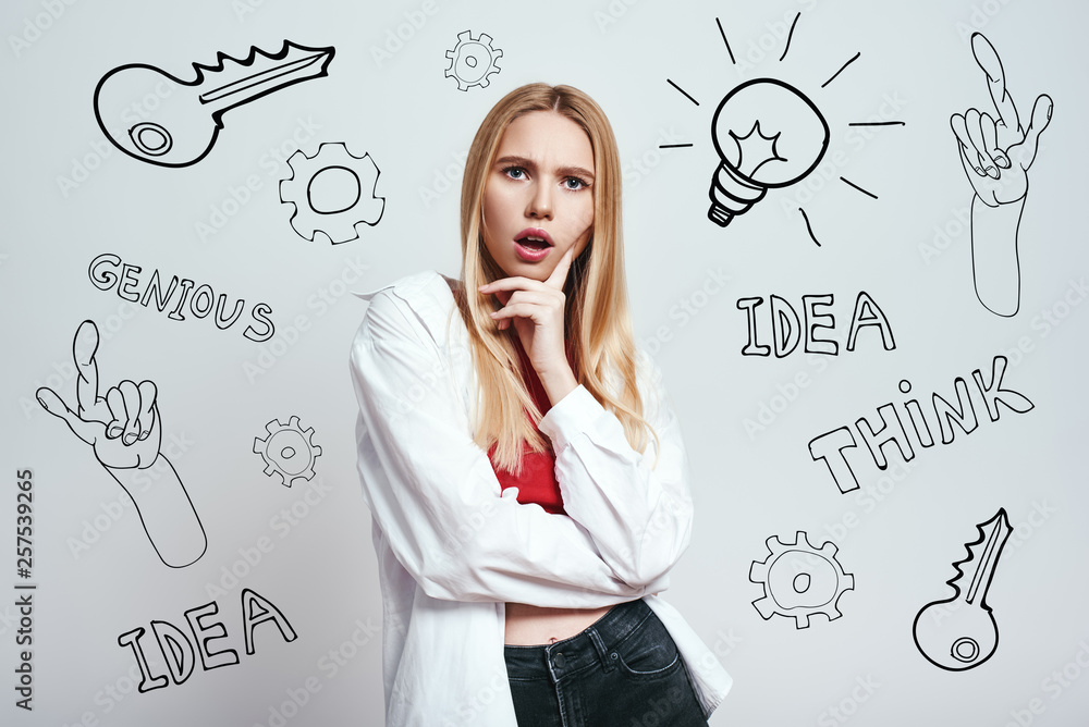 No way! Studio portrait of surprised blonde woman in casual wear while ...