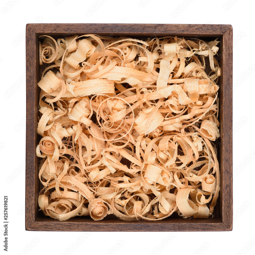 Wooden box with wood shavings straw filling isolated on white. Top view ...