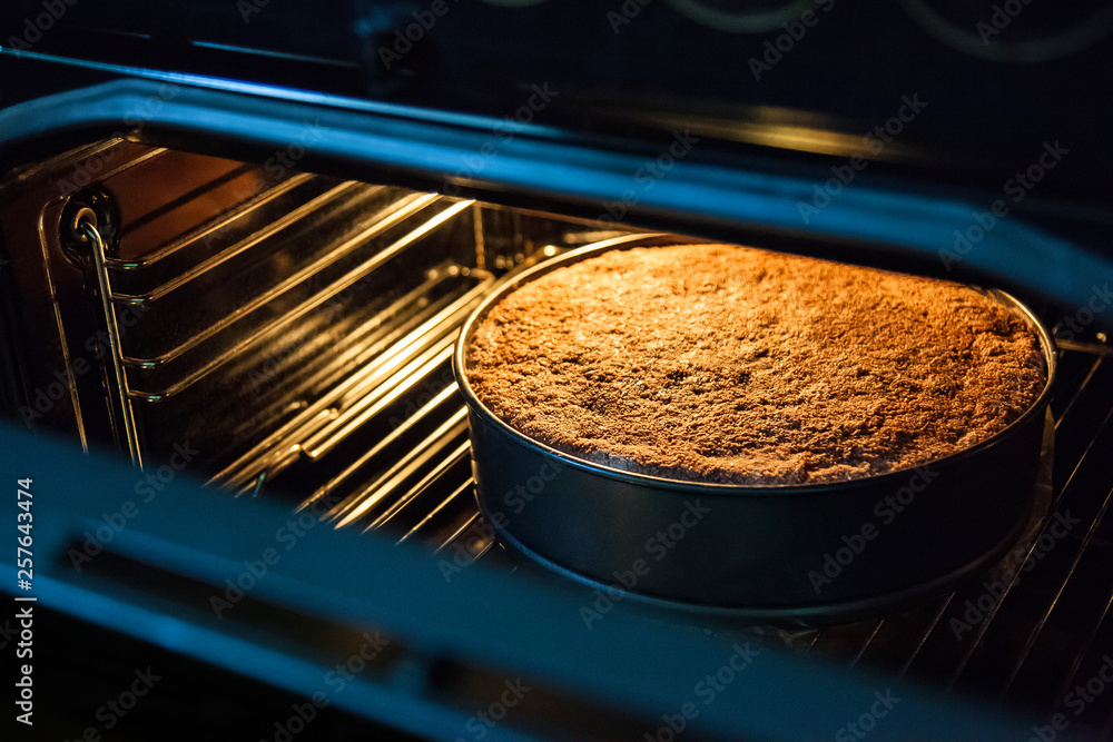Homemade cake is prepared and baked in a special form for baking in an ...