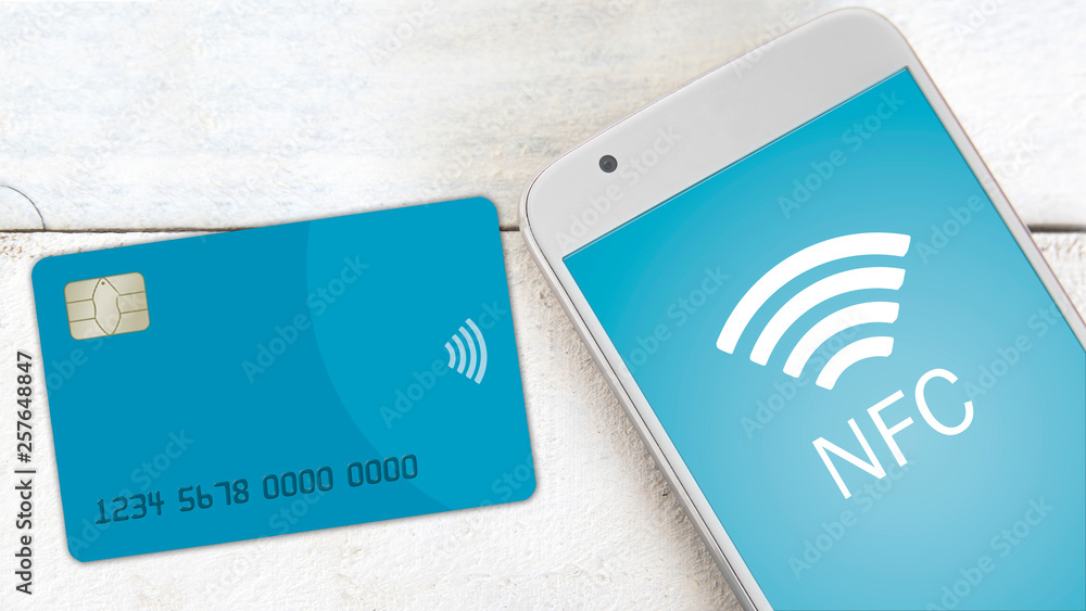 Credit card next to a smartphone mobile with NFC connection system for ...