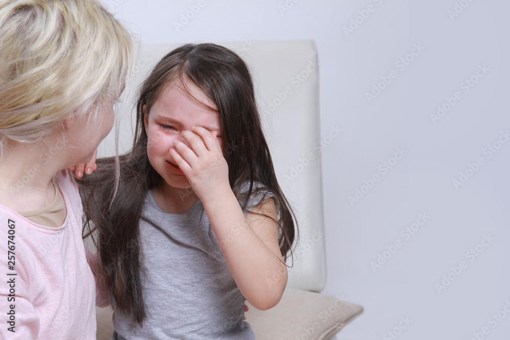 the girl was crying and screaming. a little girl crying, her mother ...