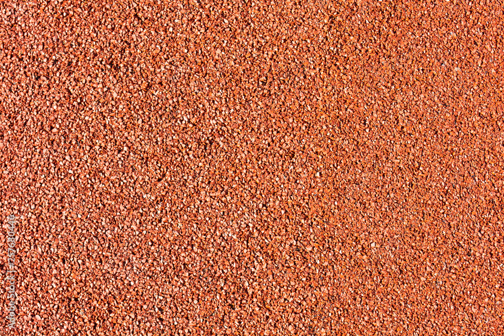 Fotka „protective red coating of crumb rubber. Texture safety ...