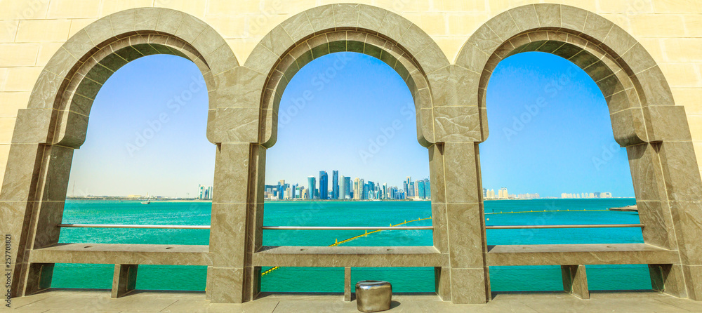 Panorama of Doha West Bay skyline through arched windows opening view ...