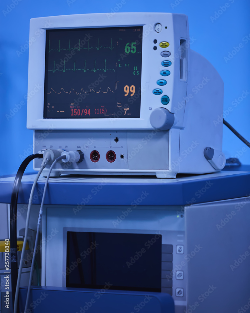 An anesthesia monitor shows real time vital signs for constant patient ...