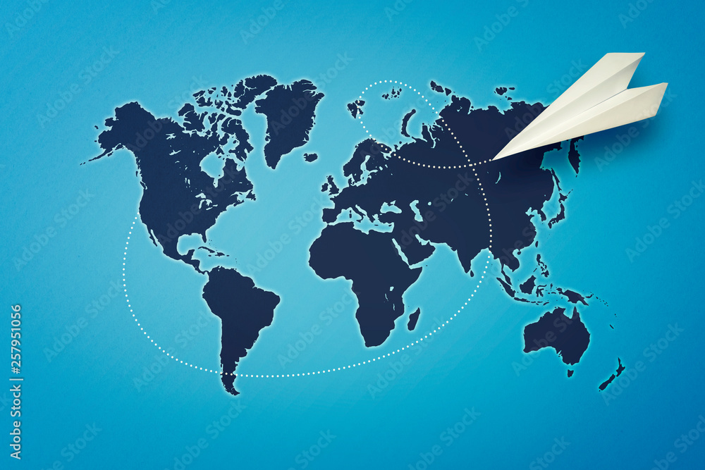 Around the world. Paper airplane flying above world map. Stock Photo ...