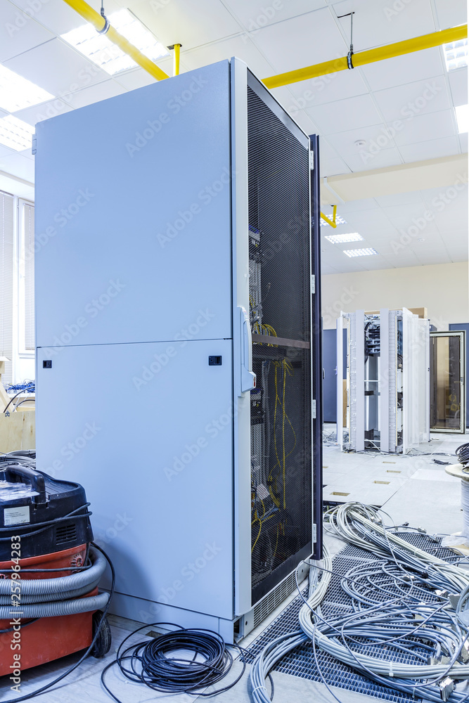process of installation and cabling in a modern data center. Server ...