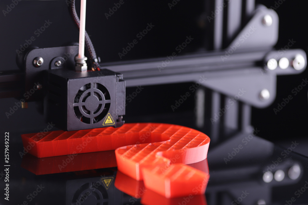 3D-printer manufacturing big question mark from red plastic - close up ...