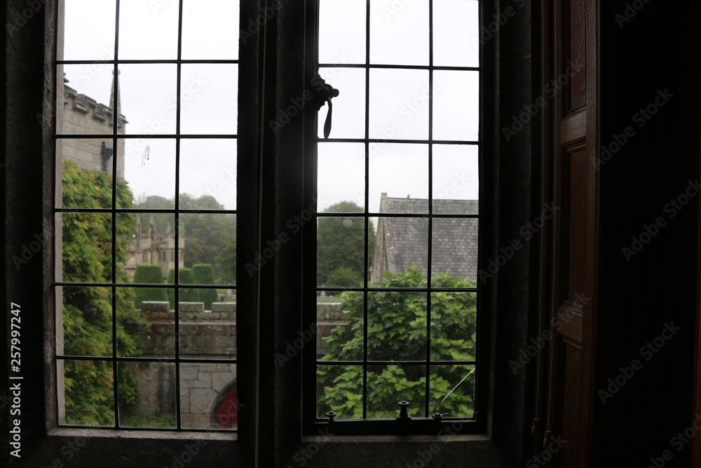 Tudor leaded window shot from inside an English manor house. A leaded ...