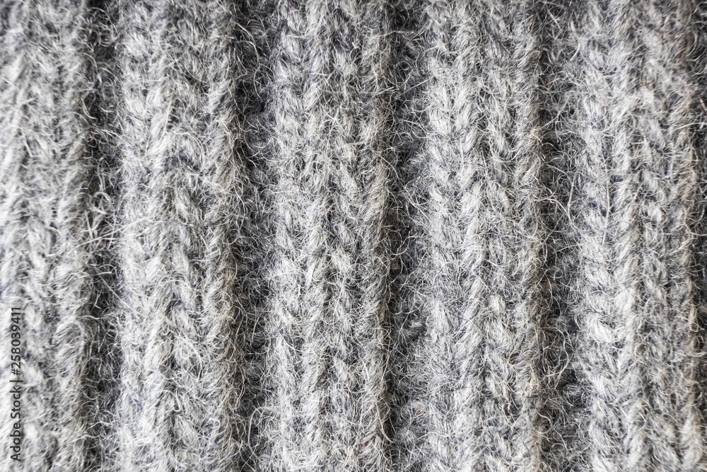 Light knitted texture closeup, visible yarn and fiber. The image is ...