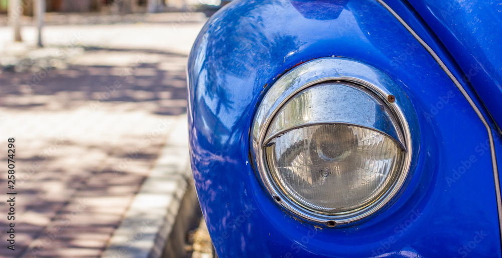blue vintage car headlight panoramic foreshortening urban environment ...