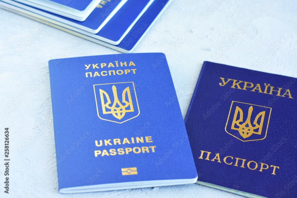 Internal passport of Ukraine with a state emblem trident and stack of ...