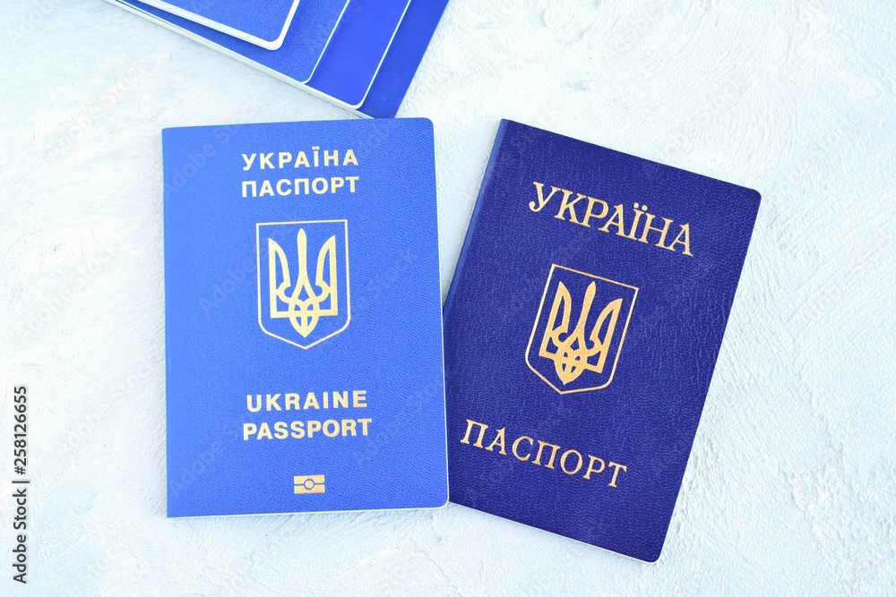 Internal passport of Ukraine with a state emblem trident and stack of ...