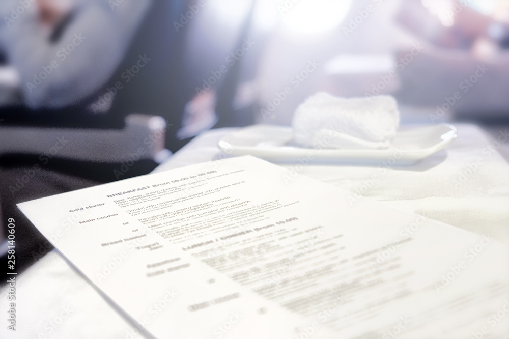 airplane business travel food menu on tray table with selection of ...