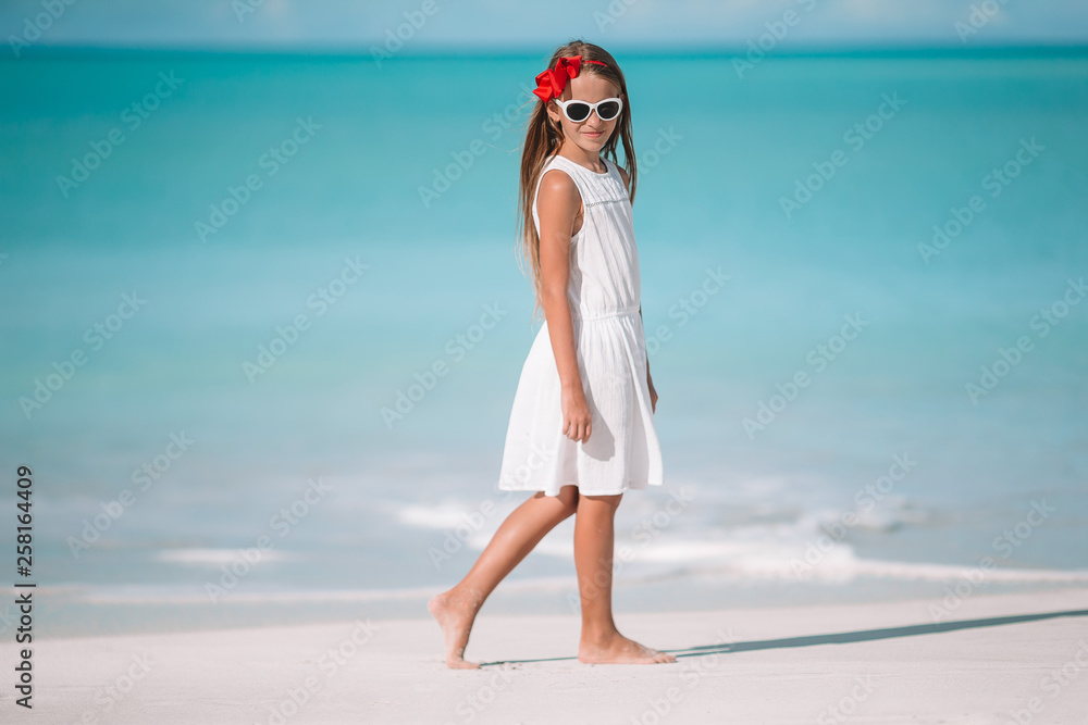 Portrait of beautiful girl on the beach dancing Stock Photo | Adobe Stock