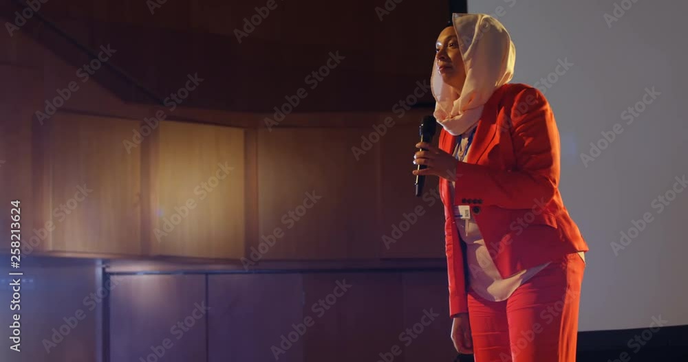 Businesswoman speaking on stage in auditorium 4k Stock Video | Adobe Stock
