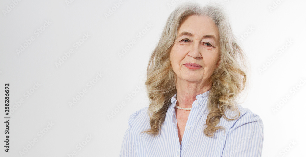 Closeup of smiling senior woman wrinkle face and gray hair. Old mature ...