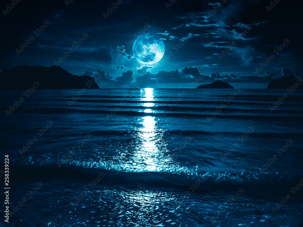 Super moon. Colorful sky with bright full moon over seascape. Stock ...