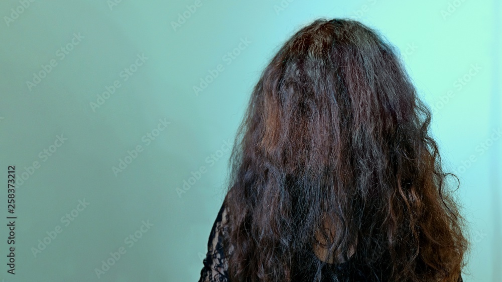Terrible brunette girl with long dark hair covering her face. Concept ...