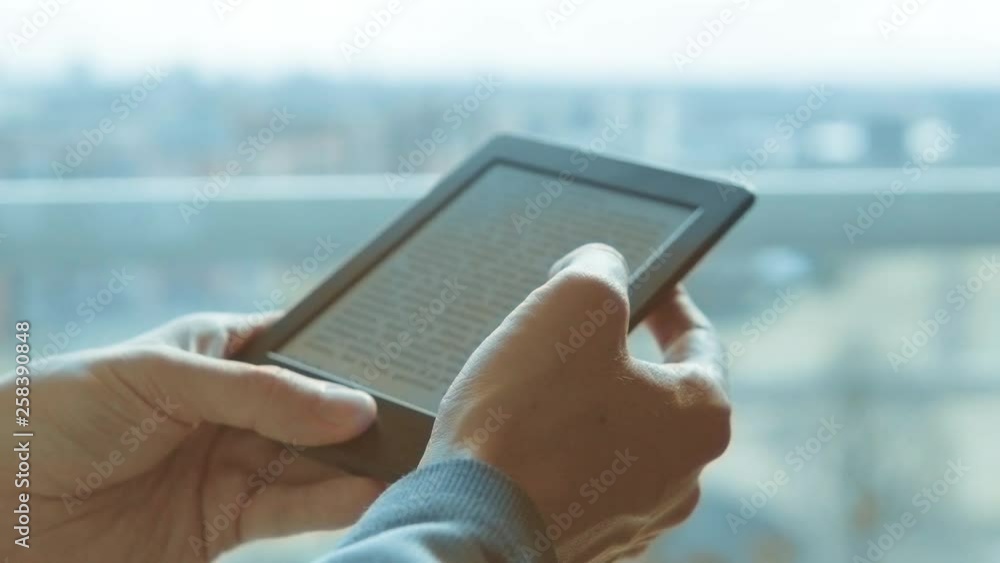 Using e-reader tablet, reading ebook Stock Video | Adobe Stock