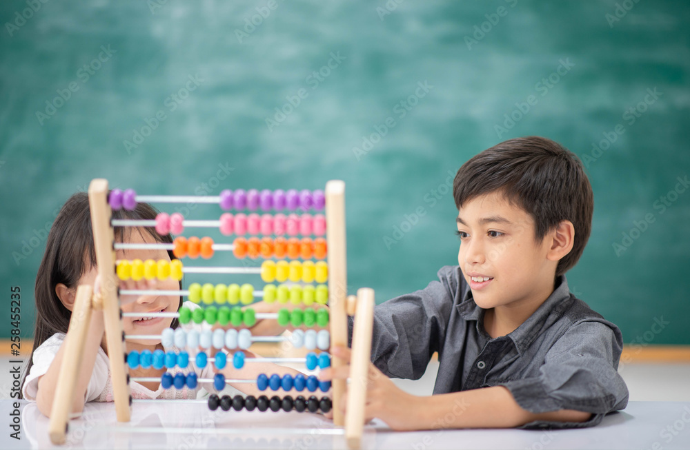 Students boy and girl leaning math in the class room Montessori Stock ...