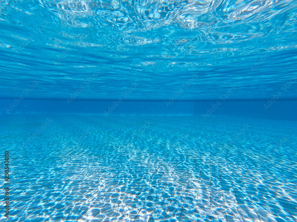 Transparent clear water in the pool. Underwater photo of the regulatory ...