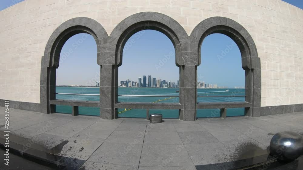 Panorama of Doha West Bay skyline through arched windows opening view ...