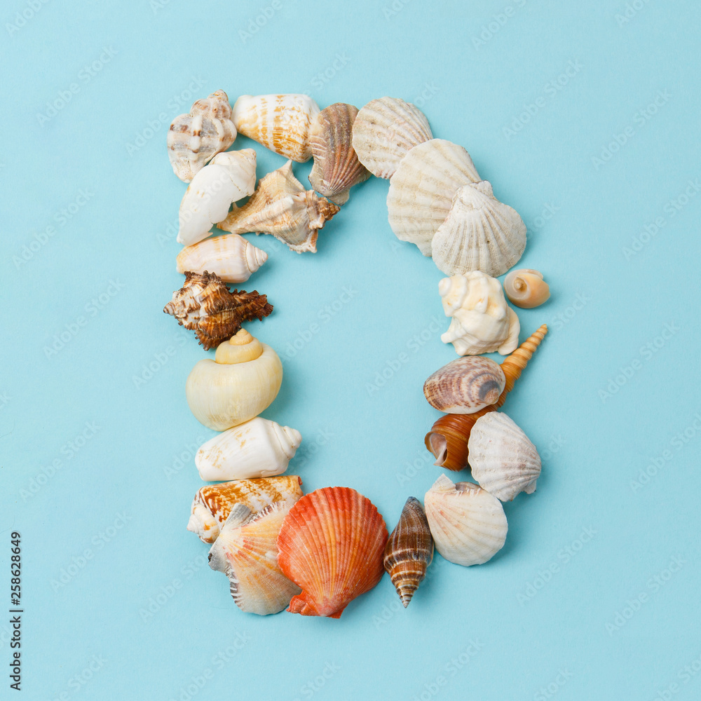 Letter 'D' from sea shells on blue background. Alphabet in marine style ...