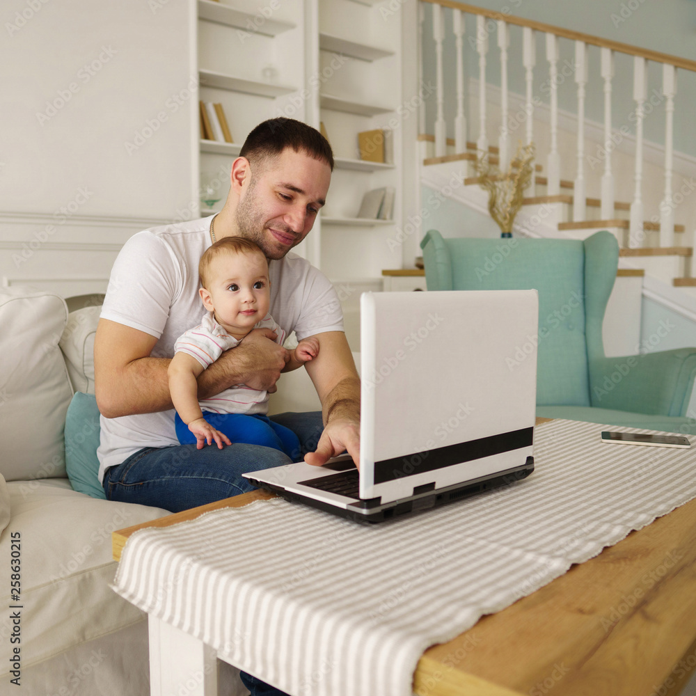 lifestyle of modern business father. young man babysitting working ...